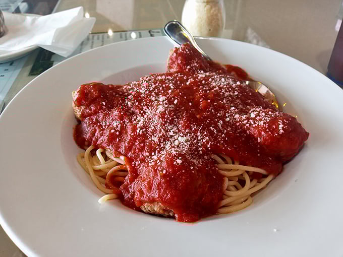 This isn't just spaghetti; it's a mountain of perfectly cooked pasta swimming in marinara that deserves its own power ballad.