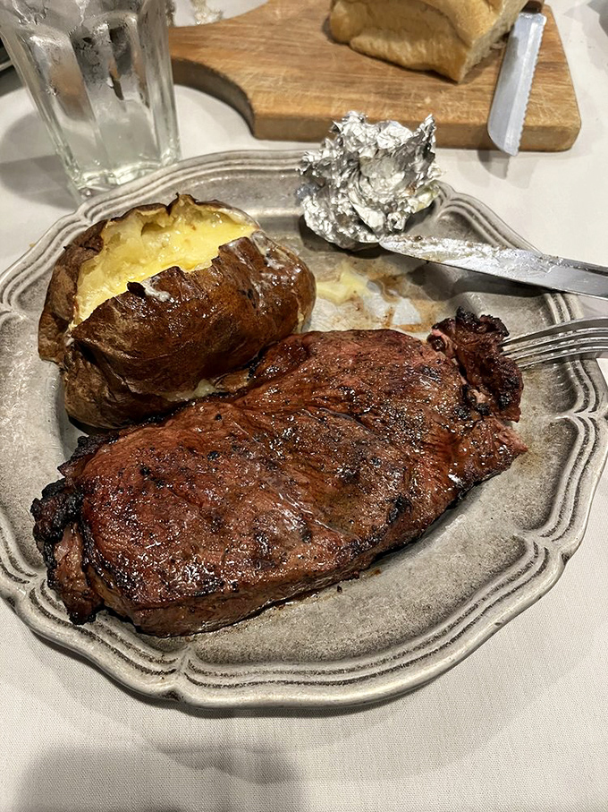Behold the perfect partnership &ndash; a gloriously seared strip steak alongside its faithful companion, the loaded baked potato. A romance for the ages.