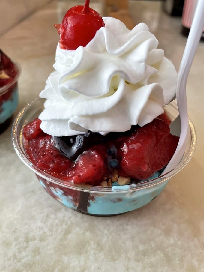 A berry sundae that doesn't just satisfy a craving&mdash;it creates new ones. That whipped cream mountain with its cherry flag claims victory over ordinary desserts.