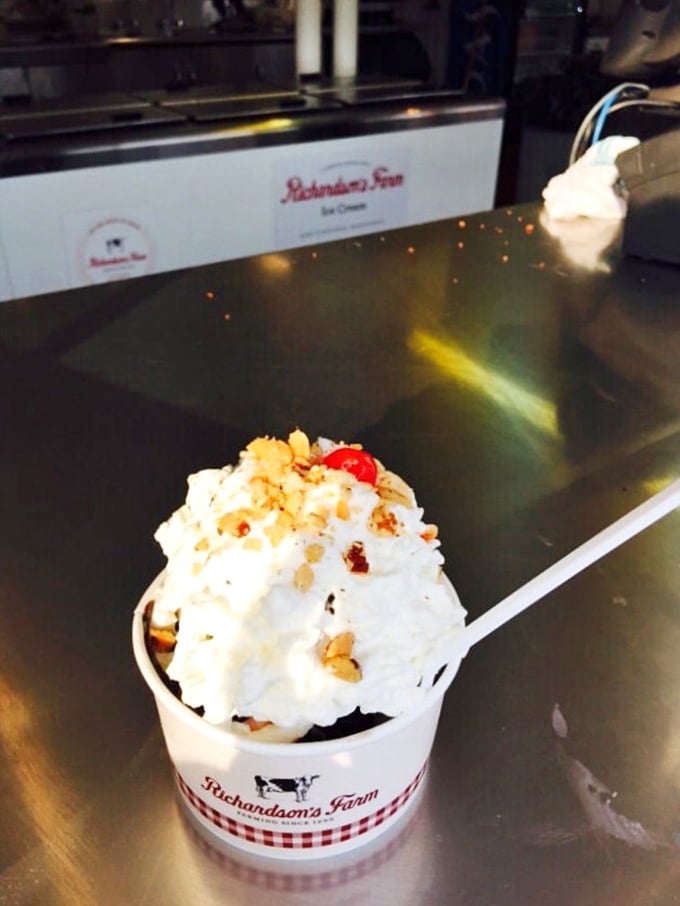 Not just a sundae but a celebration&mdash;whipped cream mountains, crunchy nuts, and that iconic cherry on top nestled in Richardson's signature cup.