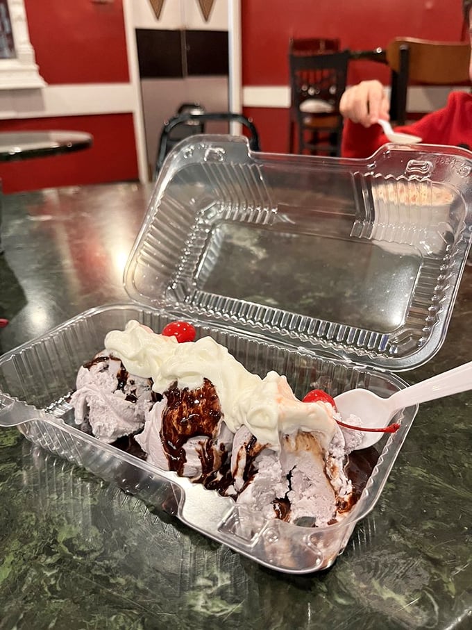 Ice cream architecture at its finest &ndash; chocolate, whipped cream, and cherries creating a dessert skyline worth the drive from anywhere in Minnesota.