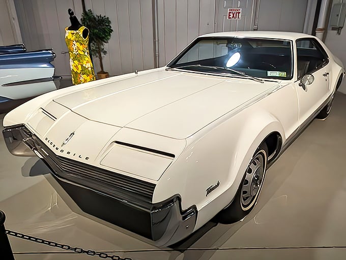 This gleaming white Oldsmobile Toronado looks ready for its close-up, a 1960s movie star with curves that would make Marilyn Monroe jealous.