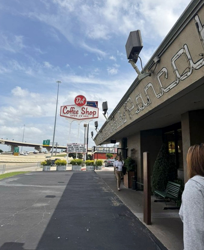Dot Coffee Shop's vintage sign stands tall against the Texas sky. When a place advertises "OPEN 24 HRS," breakfast dreams can happen anytime!