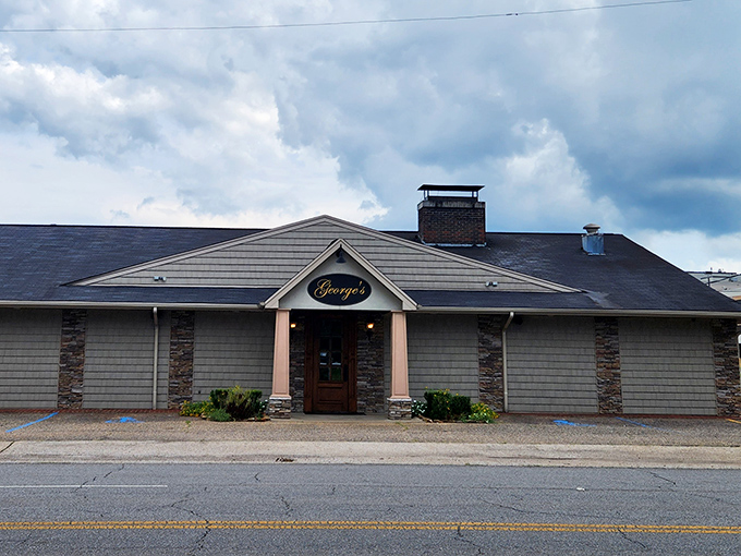 George's Steak Pit's understated exterior hides a temple of hickory-grilled perfection that locals have treasured for generations.