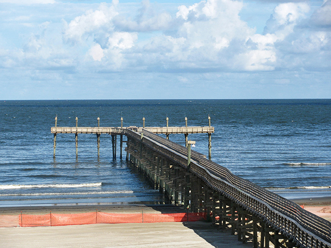 Grand Isle's pier stretches toward the horizon, inviting fishermen and dreamers alike to venture just a bit further into the Gulf.