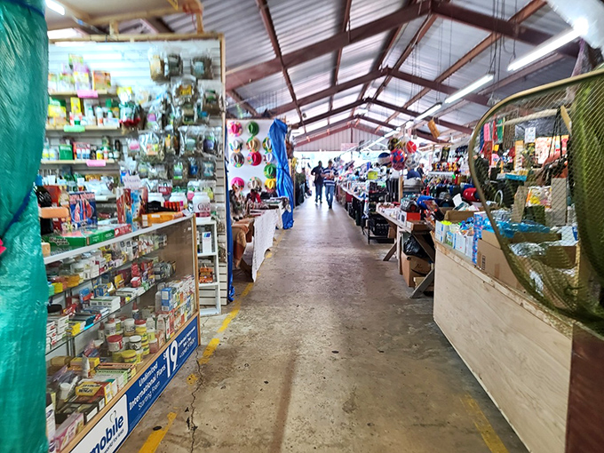 Endless aisles of possibilities! J&J Flea Market's covered walkways guide shoppers through a maze of merchandise where surprising finds lurk around every corner.