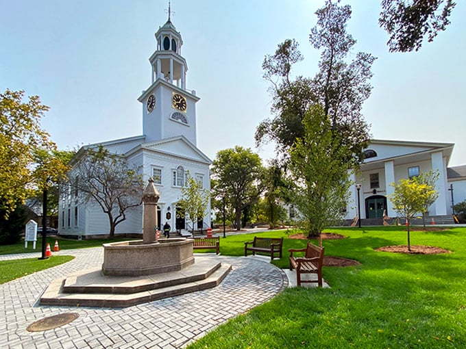 Manchester's classic white church spire reaches skyward, a beacon of New England charm that's been guiding locals home for generations.