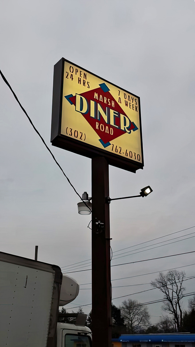 Marsh Road Diner's illuminated sign promises 24/7 comfort food&mdash;because sometimes you need pancakes at 3 AM, and that's perfectly reasonable.