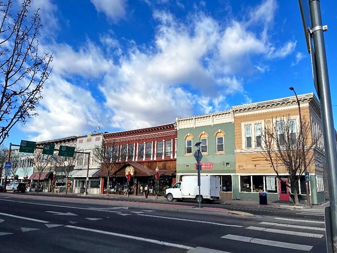 Stroll through historic downtown Montrose, where colorful vintage storefronts and friendly local businesses welcome you under beautiful blue skies.