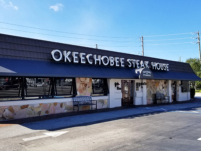 Okeechobee Steakhouse's bold blue awning announces itself with confidence – they've been perfecting steak since before most of us were born.
