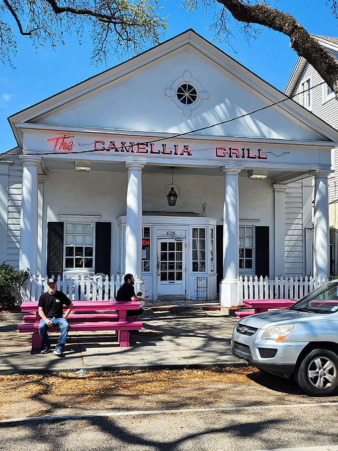 The Camellia Grill's stately white columns and pink picnic bench create the perfect Southern charm backdrop for some serious comfort eating.
