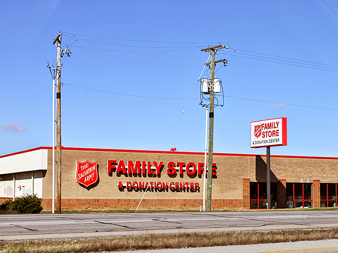 The Salvation Army's bold red signage beckons thrift enthusiasts like a lighthouse for the bargain-starved, promising treasures amid the everyday castoffs.
