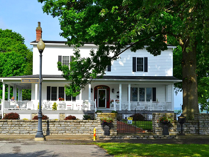 This classic white house with its welcoming porch practically whispers, "Come sit a spell" in the most delightful Kentucky accent imaginable.