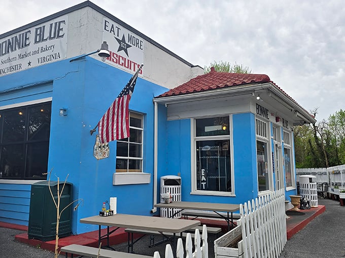 This patriotic blue bakery stands ready to serve, with a white picket fence that practically screams "American pie inside!"