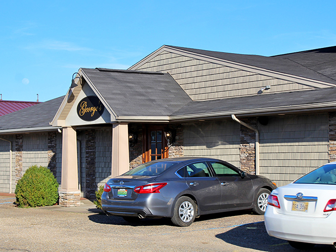 The simple sign doesn't prepare you for the smoky magic happening inside - George's is where steak dreams come true.