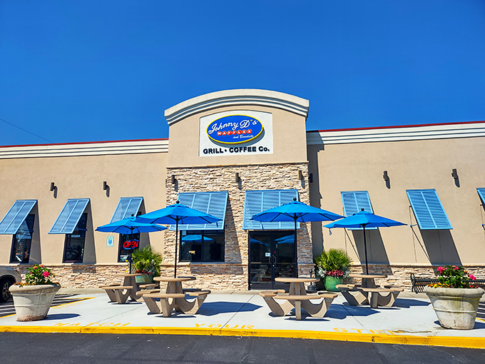 Blue umbrellas and sunshine—Johnny D's outdoor seating area is where vacation mode officially begins, one waffle at a time.