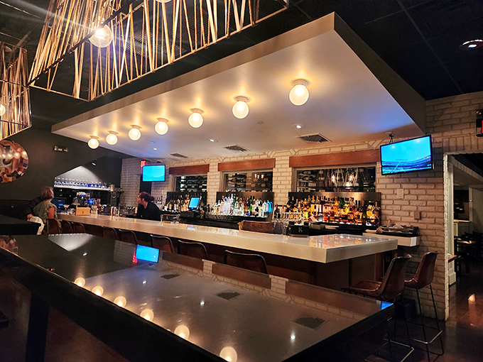 The bar at KC Prime gleams with possibility &ndash; each bottle a promise that your evening is about to get significantly better.