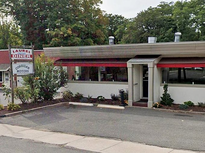 Laurel Diner entrance: "Red awnings and meticulous landscaping signal attention to detail&mdash;the same care that makes their eggs Benedict legendary."