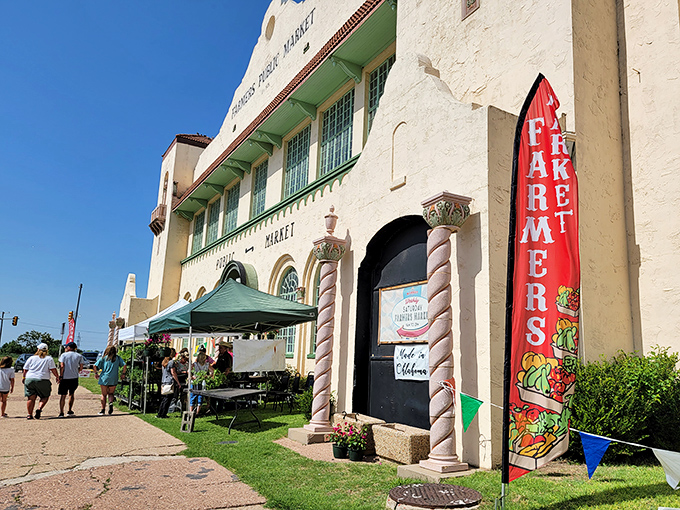 Potted plants create a festive atmosphere inside the Farmers Market. Shopping becomes a celebration here!