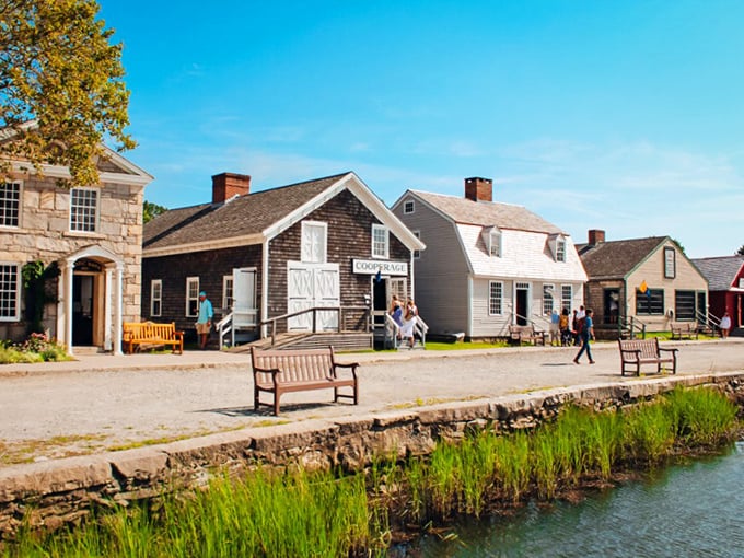 Charming historical buildings and peaceful waterfront views await you along the gravel paths of Old Mystic on this bright, sunny day.