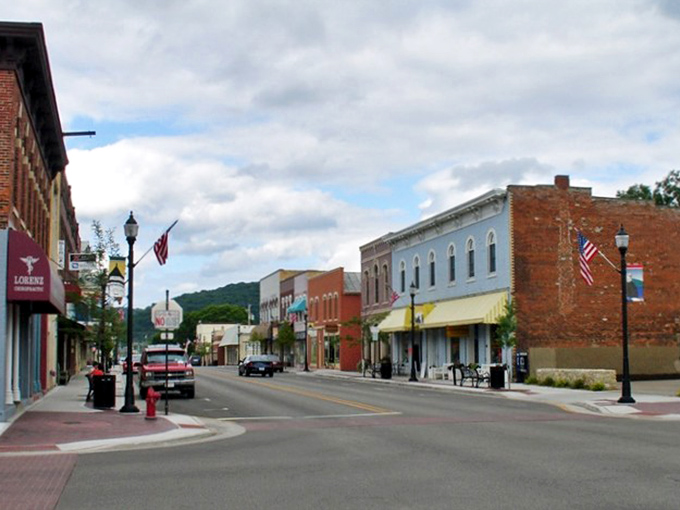 Brick storefronts line Prairie du Chien's downtown, where Mississippi River views come standard but coastal price tags don't.