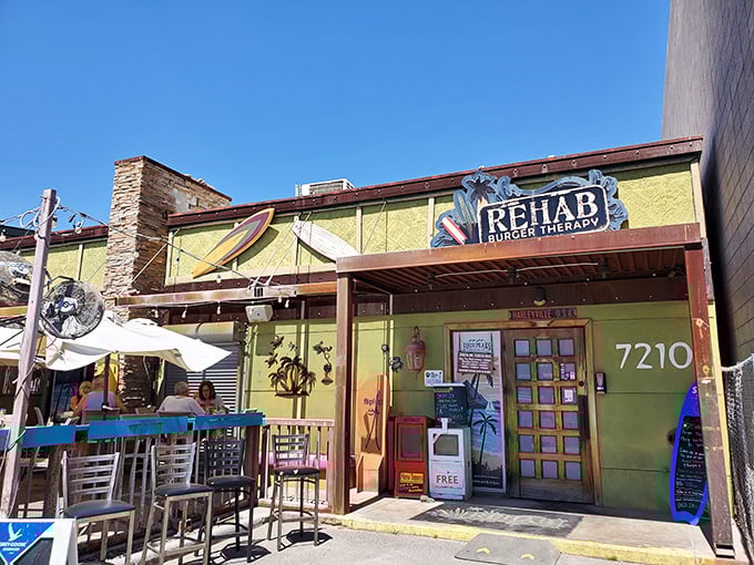 Beach vibes in the desert? Rehab Burger Therapy's colorful patio feels like a coastal getaway, just add burgers.