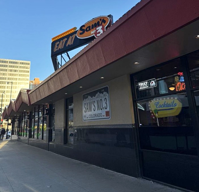 The classic "EAT AT SAM'S" sign might be the most honest dining advice in all of Denver.