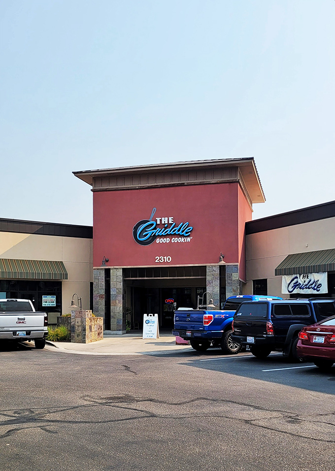 Shopping center location, destination-worthy pancakes. Those neon "OPEN" signs are basically saying "Your breakfast dreams await!"