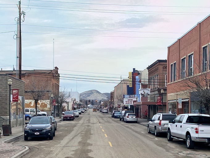 The warm glow of sunset bathes Weiser's storefronts, where shop owners still flip "Closed" signs to chat with neighbors.