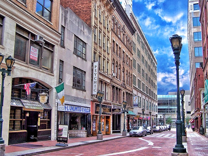 This brick-paved West Hartford sidewalk, complete with memorial and planters, invites leisurely strolls through the shopping district.