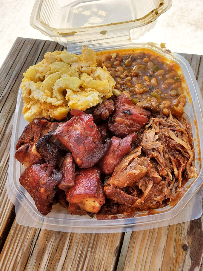 The holy trinity of barbecue: brisket, pulled pork, and beans. It's like a meaty version of rock, paper, scissors.