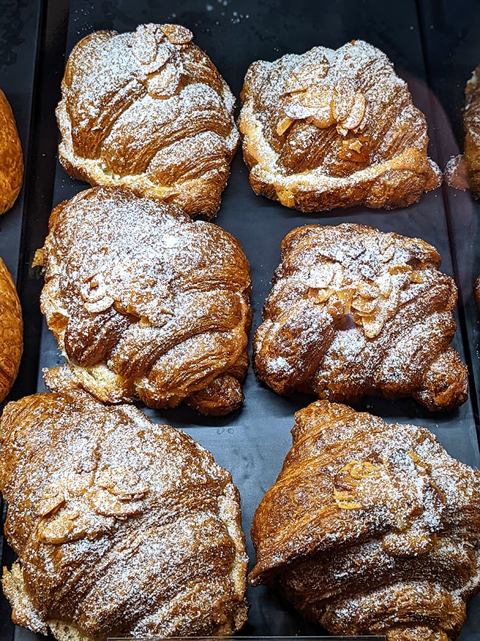 These almond croissants look like they're auditioning for the pastry version of "America's Got Talent." The powdered sugar topping is their final, show-stopping flourish.