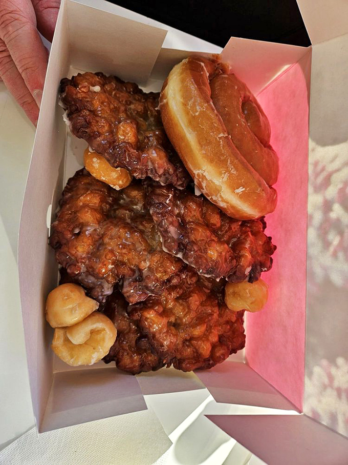 These golden-brown beauties aren't just donuts; they're edible sunshine. The glaze crackles with each bite like nature's perfect symphony.