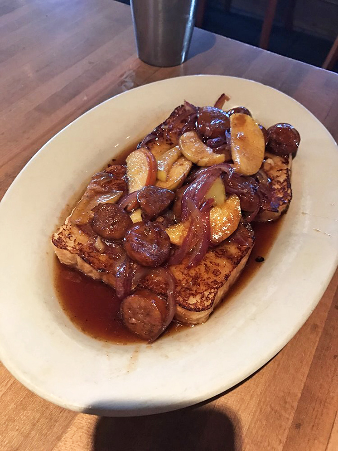 Saut&eacute;ed apples and sausage transform ordinary French toast into an extraordinary experience &ndash; proof that breakfast can indeed be art.
