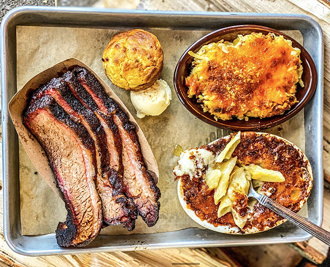 Brisket with that perfect pink smoke ring, cornbread that crumbles just right, and mac and cheese that's practically strutting. Comfort food's greatest hits album.