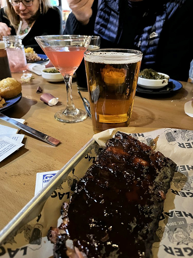 The holy trinity of dining pleasure: craft beer, cocktail companion, and ribs so lacquered they could be in a museum of meaty masterpieces.
