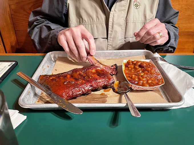 Someone's having what I call "The Executive Lunch." Those ribs look so good they'd make a vegetarian consider a career change.