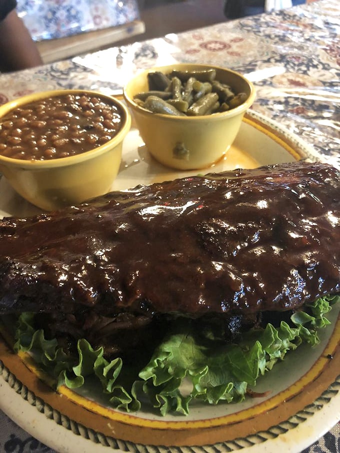 When ribs glisten like this, time slows down. The beans and greens are excellent supporting actors, but that shiny, sauce-lacquered meat is clearly the headliner of this plate.