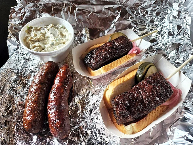 Sausage with that snap that makes your ears as happy as your mouth, alongside BBQ sandwiches with meat so dark and bark so perfect it's practically wearing evening attire.