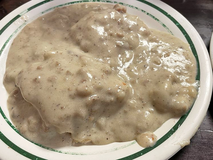 Biscuits and gravy so good they should require a permission slip. This creamy, peppery blanket of comfort doesn't just satisfy hunger&mdash;it erases worries.
