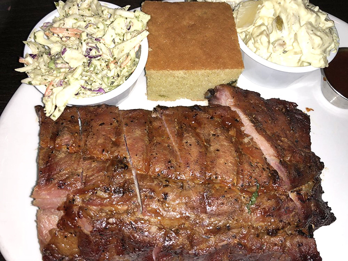 This brisket has the kind of smoke ring that would make Texas jealous, paired with classic sides that complete the BBQ trinity.