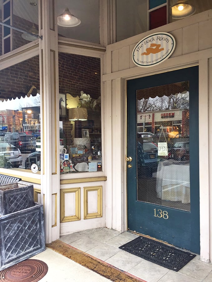 The Back Room's inviting entrance feels like the prelude to a wonderful secret. Vintage treasures await behind that teal door with golden accents.