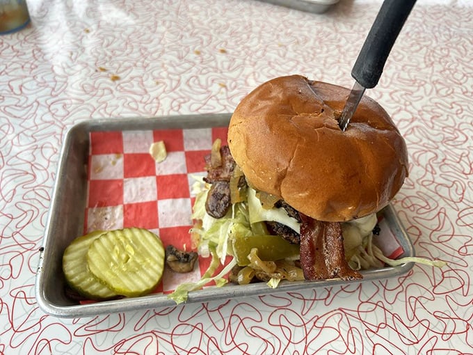 Some burgers are just sandwiches with aspirations. This one graduated with honors from Burger University, with a major in bacon and a minor in pickle.