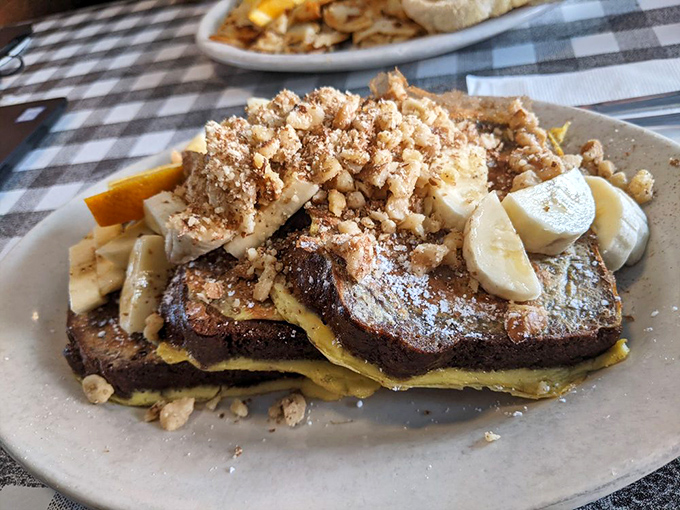 Banana bread transformed into French toast&mdash;a breakfast innovation that deserves its own Nobel Prize. Those walnuts add the perfect crunch factor.