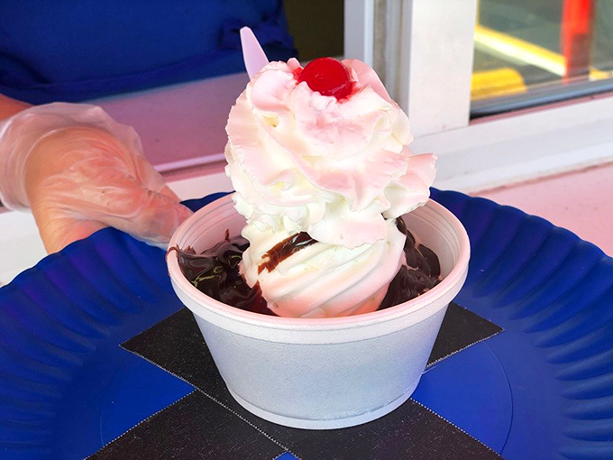 This hot fudge sundae isn't just dessert, it's architecture&mdash;layers of vanilla, chocolate, and whipped cream creating the Taj Mahal of treats.