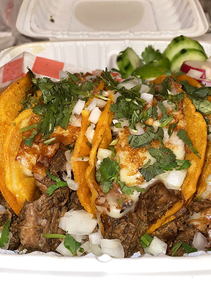 These tacos don't need fancy plating&mdash;just fresh cilantro, diced onion, and perfectly seasoned meat. The lime wedge isn't a garnish, it's essential equipment.