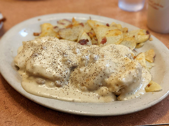 This isn't just biscuits and gravy; it's a gravity-defying cloud of comfort smothering home-style potatoes. Your diet can start tomorrow.