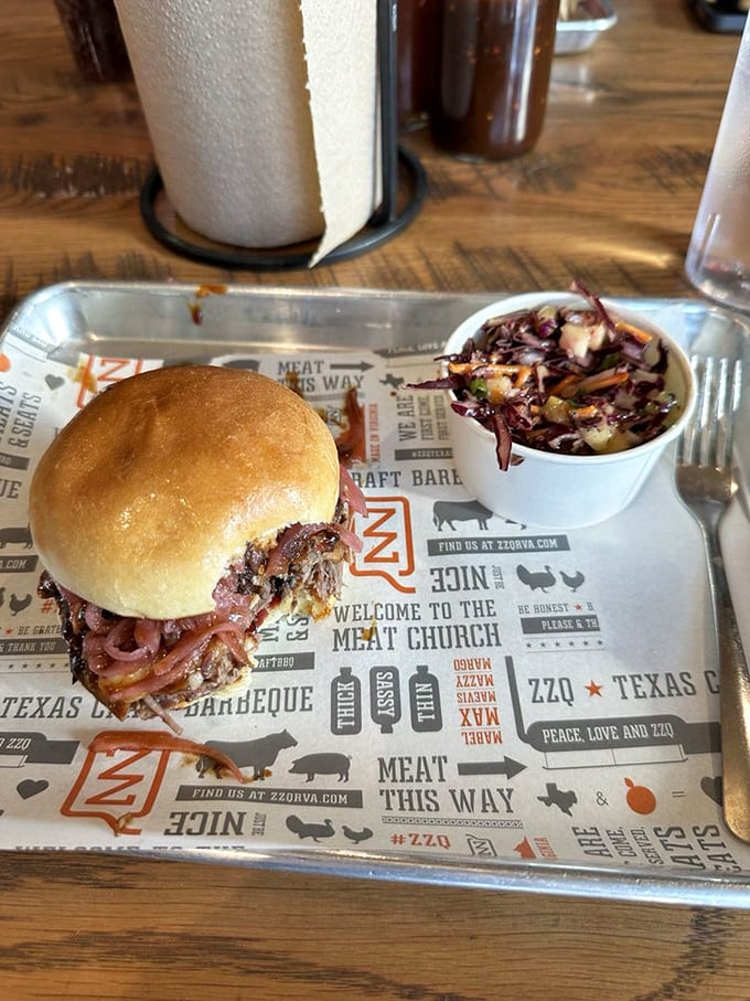 This isn't just a sandwich&mdash;it's architecture. Layers of smoky meat and pickled red onions create a skyscraper of flavor that demands a two-handed salute.