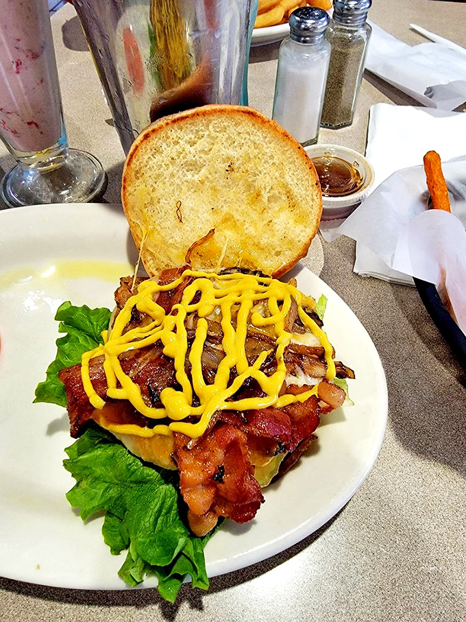 The bacon cheeseburger with mustard drizzle is what would happen if comfort food went to finishing school&mdash;refined yet deliciously unpretentious.