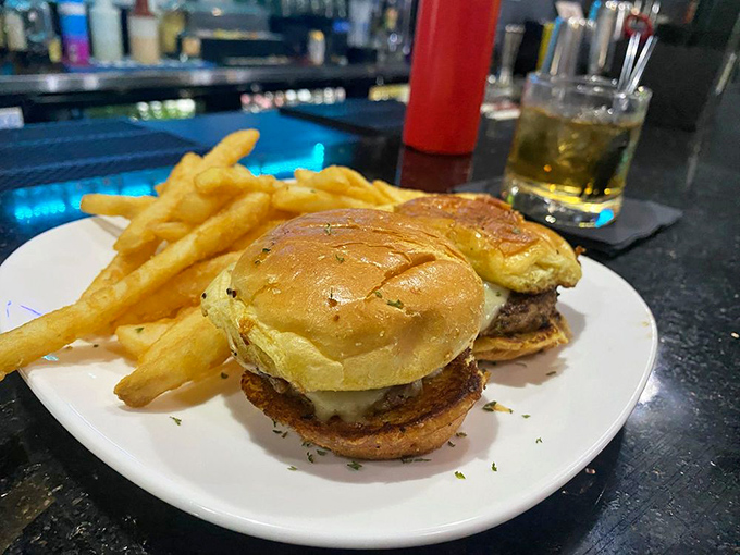 These aren't just sliders; they're happiness in handheld form. The golden fries aren't sidekicks&mdash;they're co-stars in this delicious production.